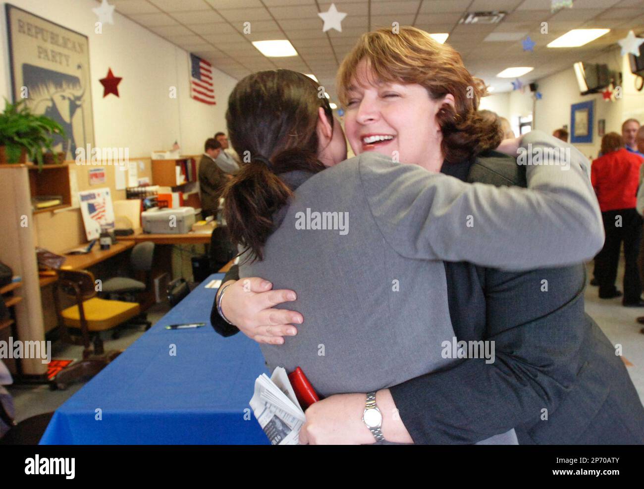 Republican mayor candidate Paula Hughes gets a hug from Tera K. Klutz ...