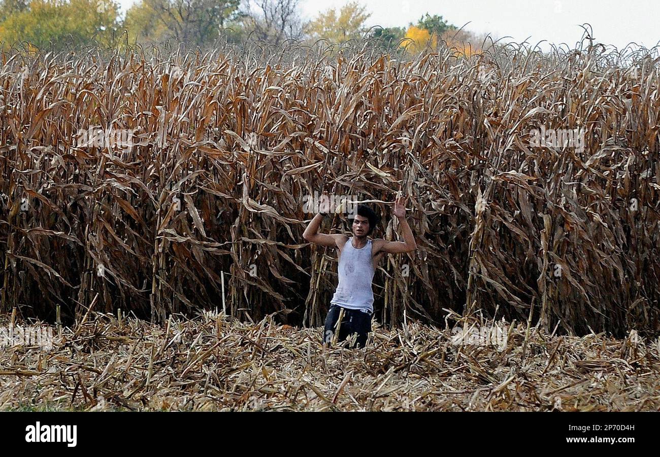 In this Wednesday, Oct. 12, 2011, Daniel Thomas,19, surrenders to ...