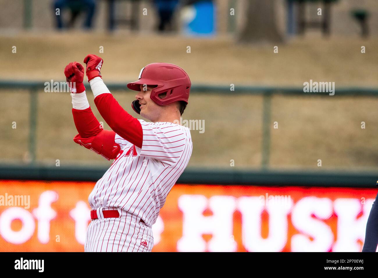 Nebraska's Charlie Fischer celebrates after hitting a double against ...