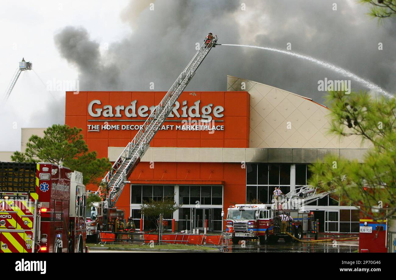 Firefighters battle a 3-alarm commercial fire Wednesday, Oct. 12, 2011 ...