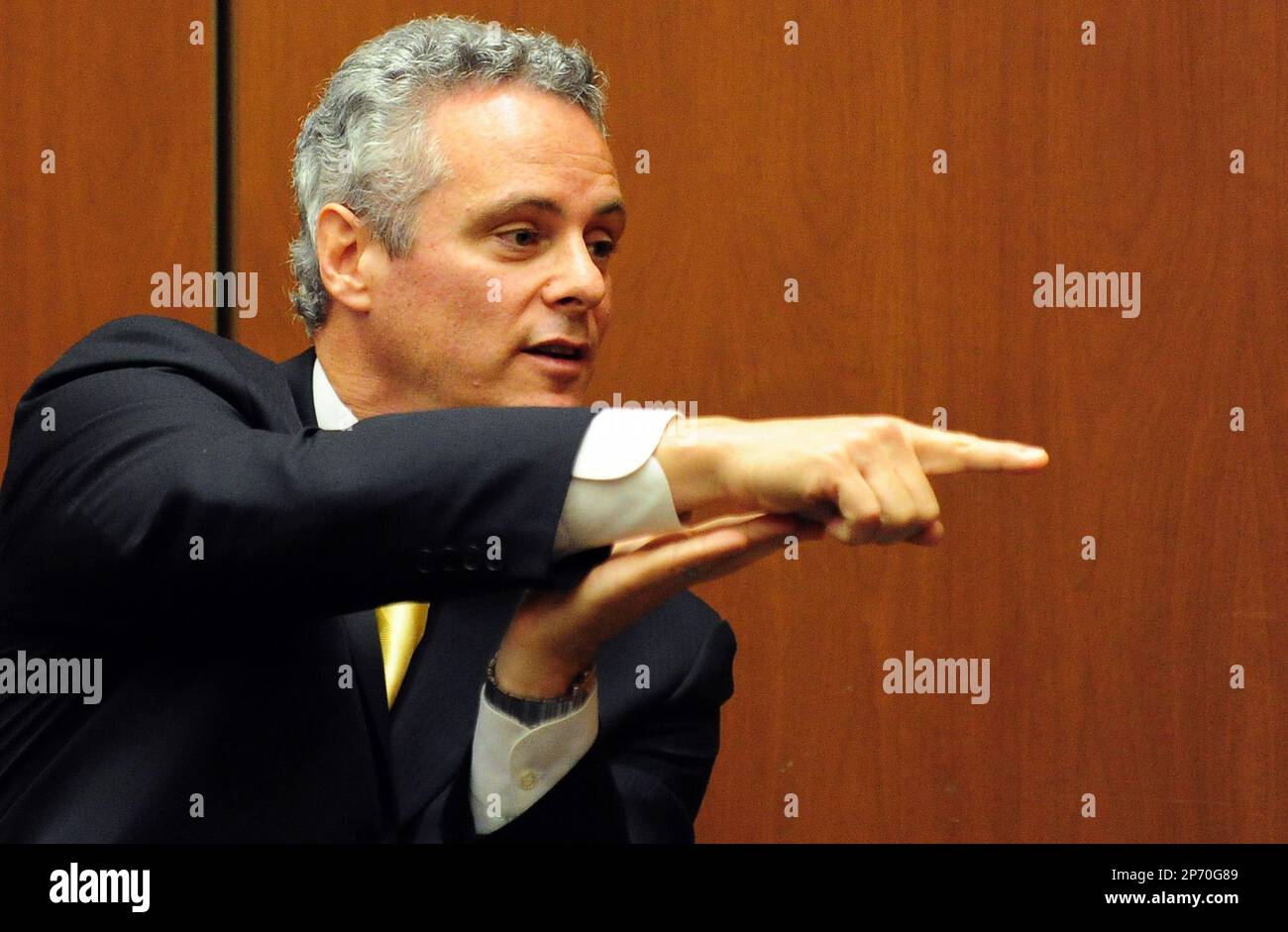 Dr. Alon Steinberg gestures on the witness stand during Conrad Murray's ...