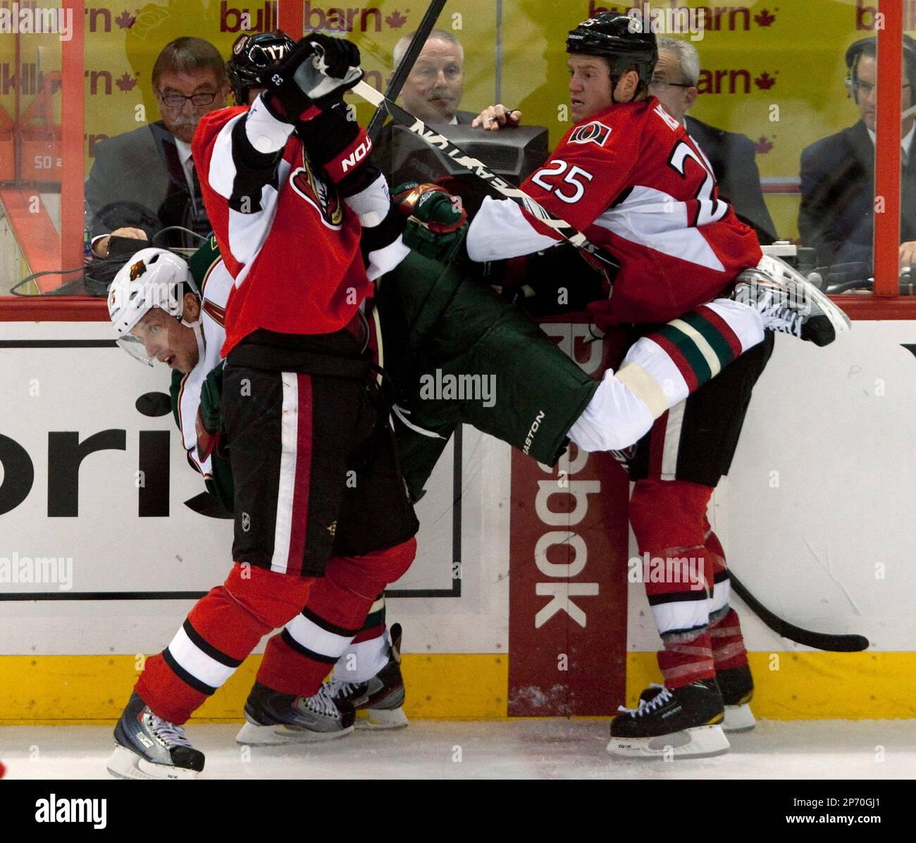 Ottawa Senators' Chris Neil (25) and Filip Kuba collide with Minnesota ...