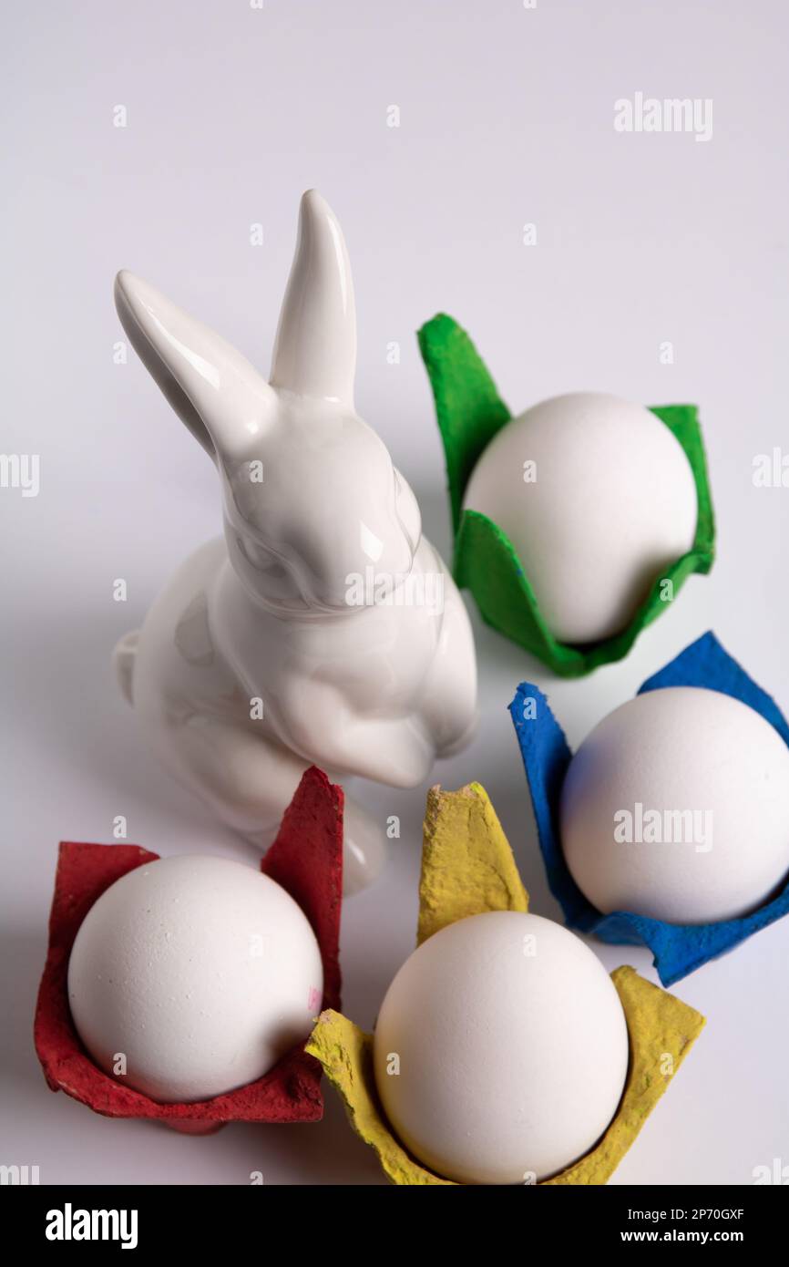 photo white chicken eggs in colored individual packages and a white ...