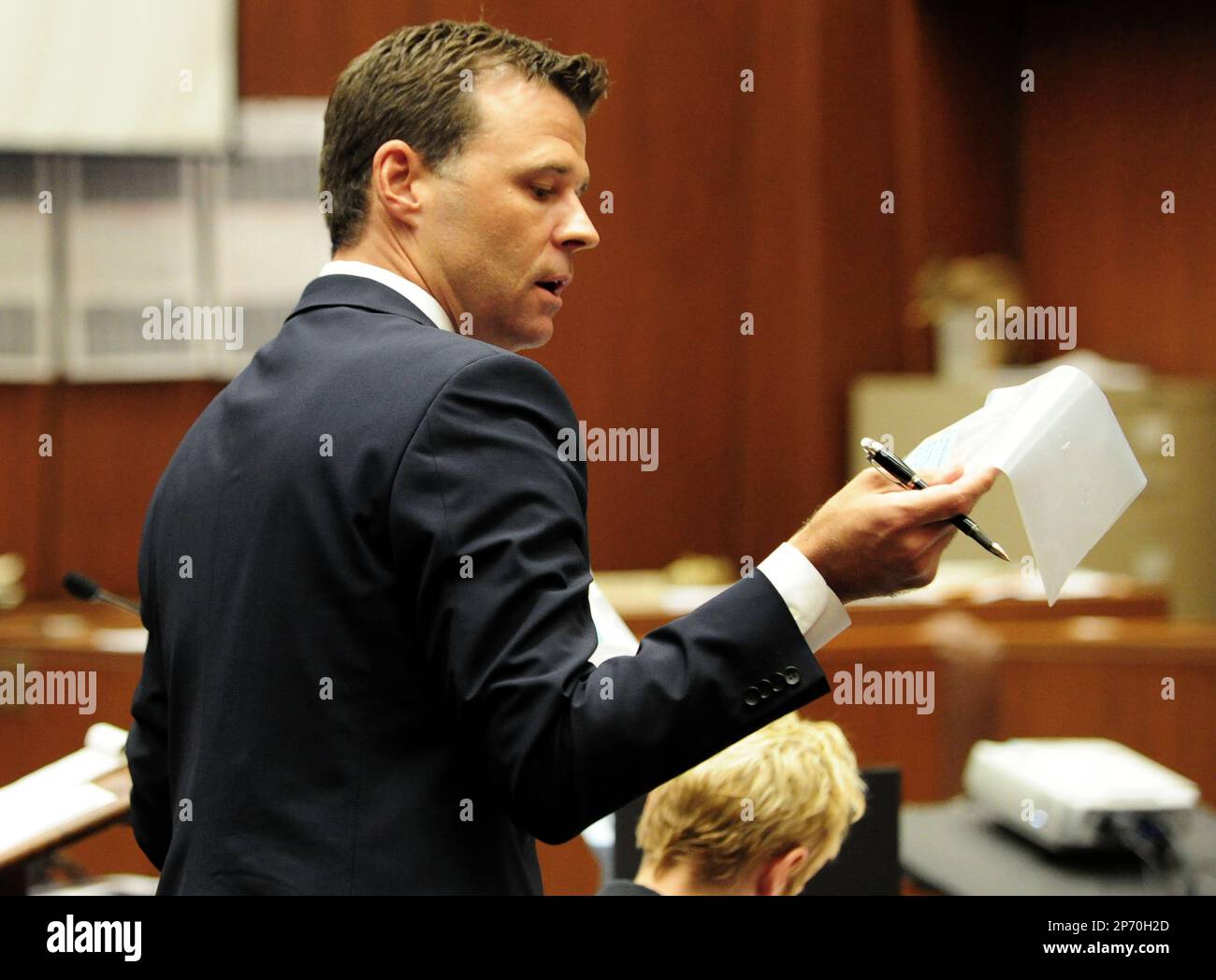 Deputy district attorney David Walgren holds a bag of evidence while ...