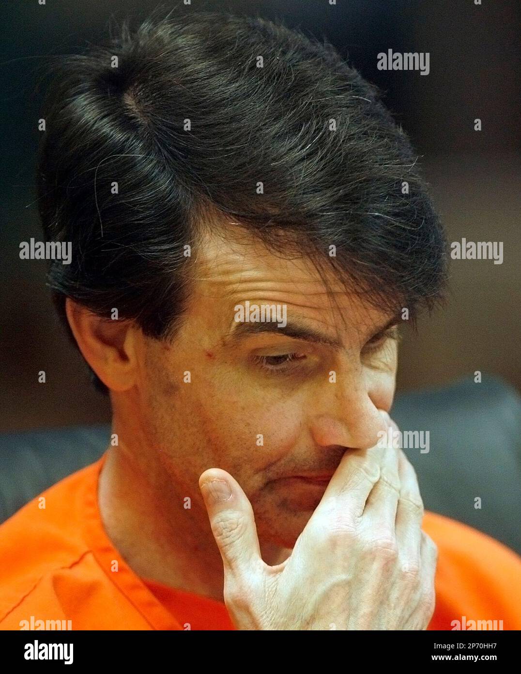 James Kraig Kahler covers his mouth while a victim statement was being ...