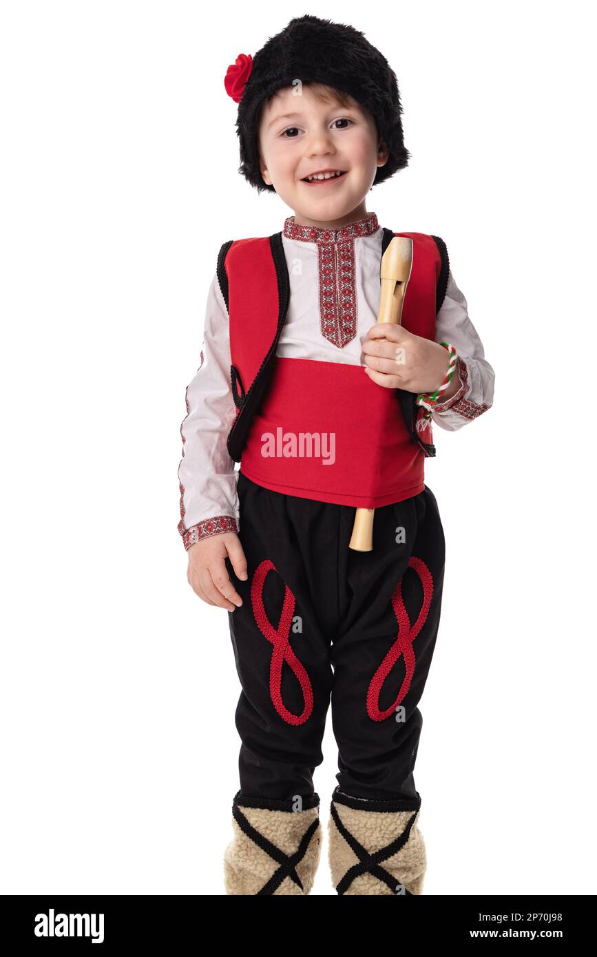 Bulgarian boy in traditional folklore costumes with spring flowers ...