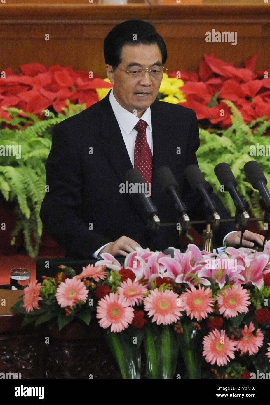 Chinese President Hu Jintao gives a speech at a conference to ...
