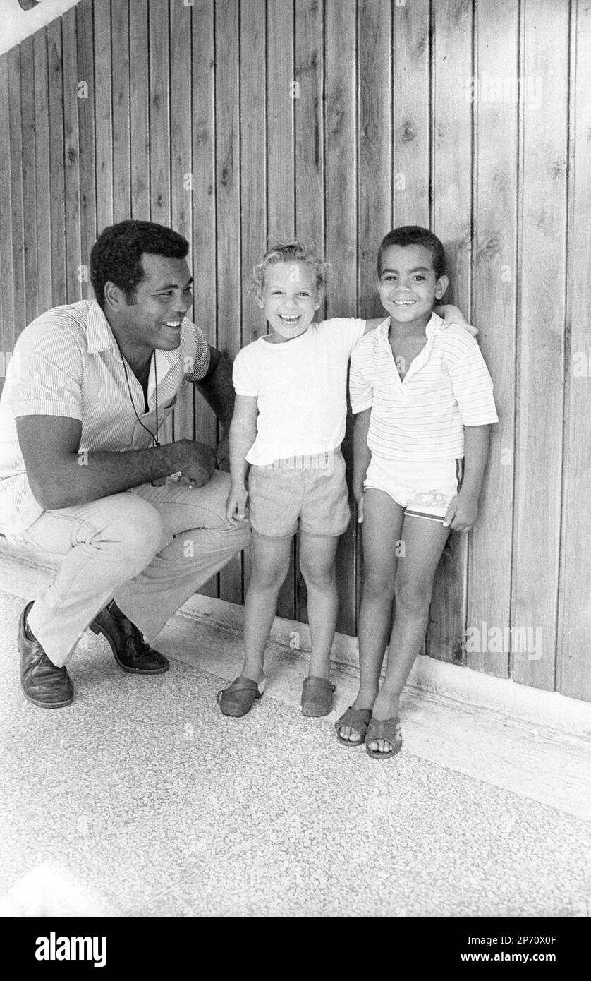 Cuban boxer Teofilo Stevenson, left, poses for pictures with his ...