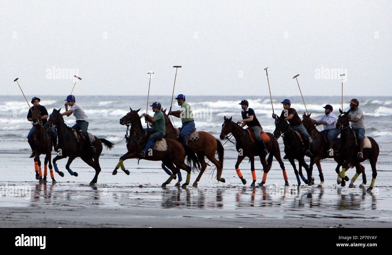 Pakistani horse riders play polo at Karachi's beach in Pakistan, on ...