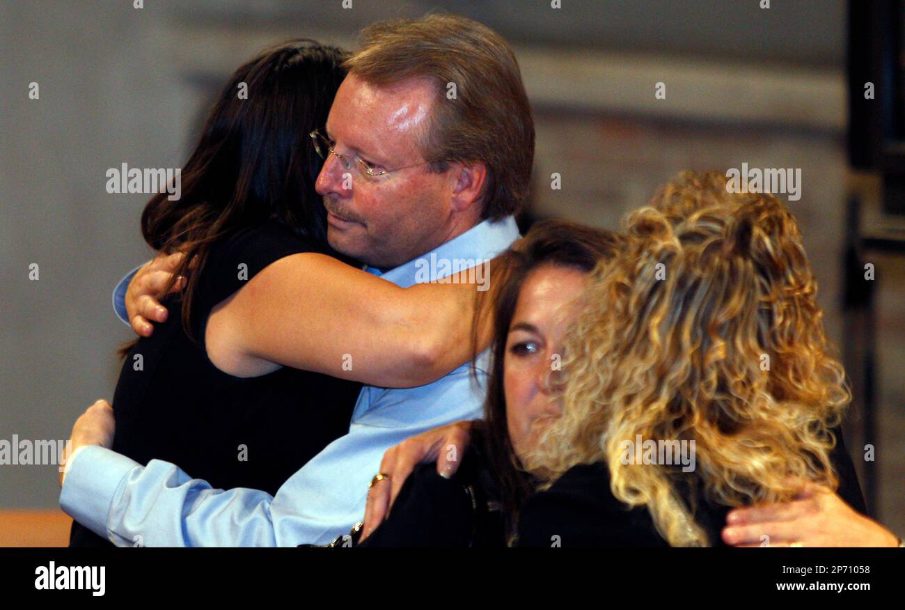 Amanda Knox's father, Curt, second form left, hugs his ex wife (Amanda ...