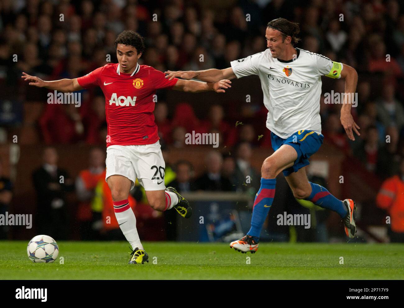 Fabio Da Silva of Manchester United challenged by Marco Streller of FC ...