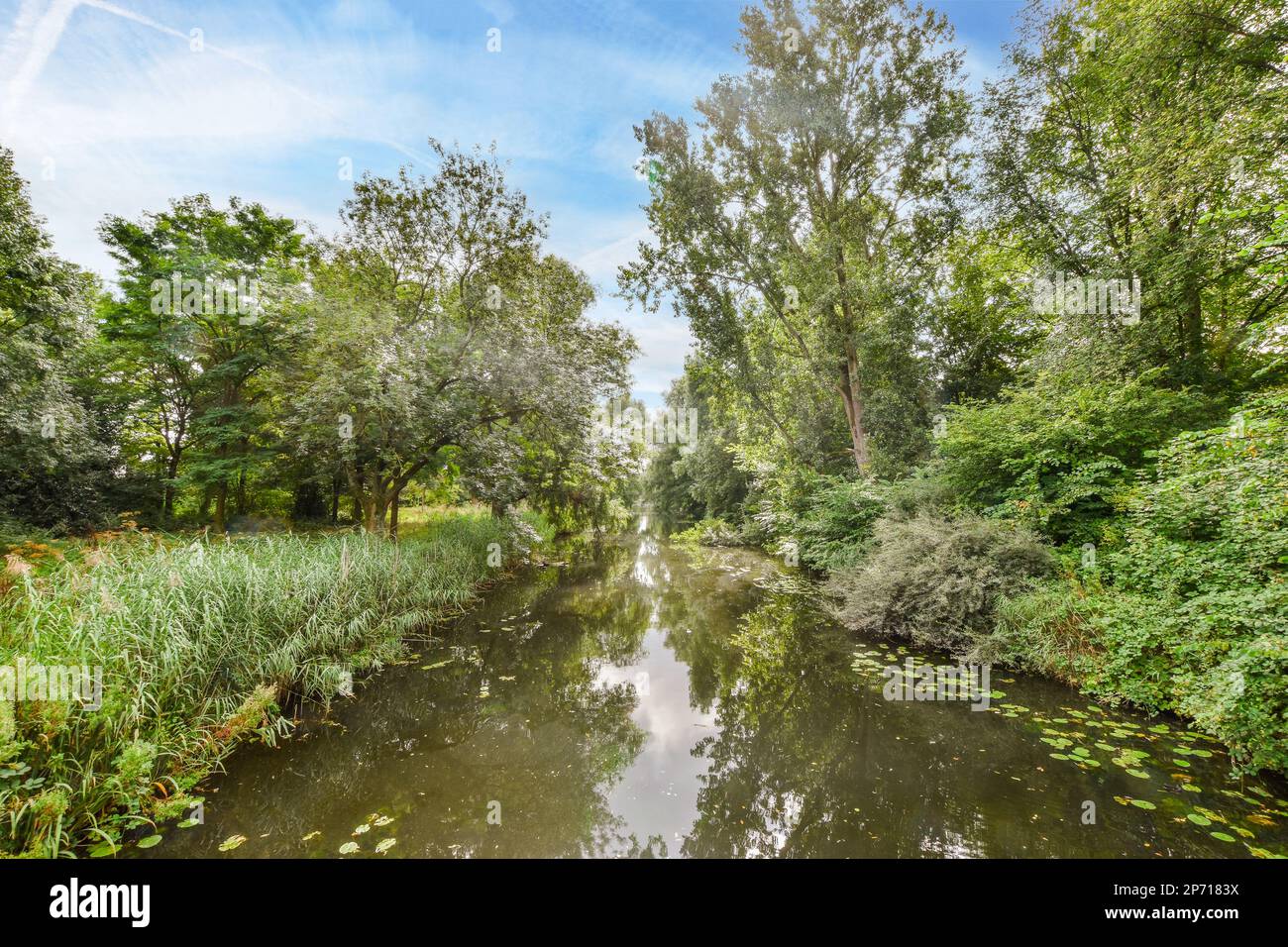 Amsterdam, Netherlands - 10 April, 2021: a river in the middle of a ...