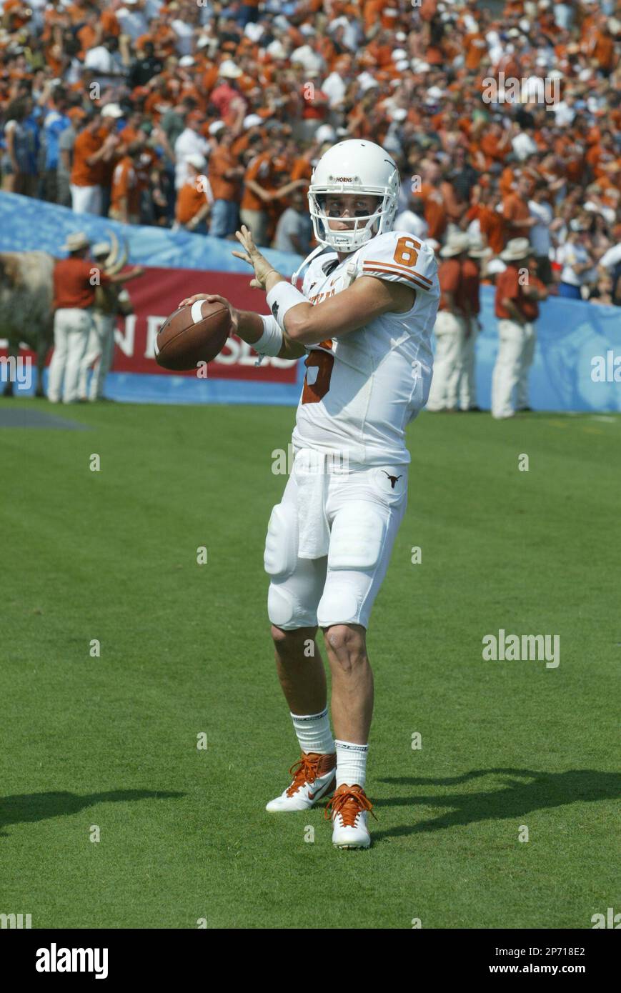 Case McCoy of the Texas Longhorns warms up on the sideline verse the ...