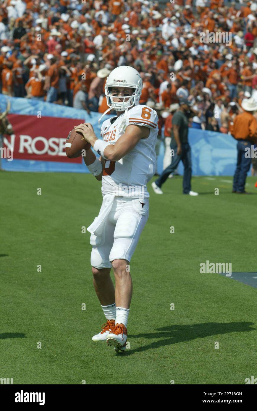 Case McCoy of the Texas Longhorns warms up on the sideline verse the ...