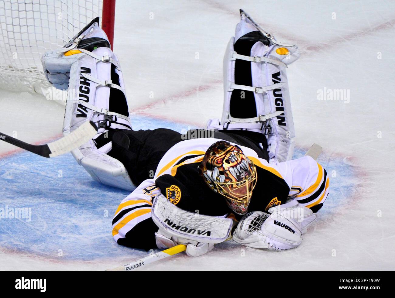 Boston Bruins goalie Tuukka Rask dives to stop the puck during the ...