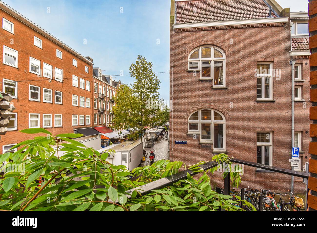 an outside area with buildings and trees in the fore, taken from a ...
