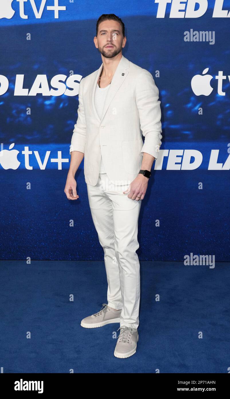 Maximilian Osinski arrives at the season three premiere of "Ted Lasso ...