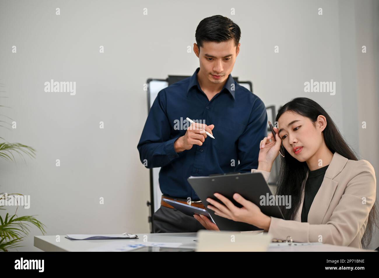 Professional millennial Asian businessman concentrated on working with ...