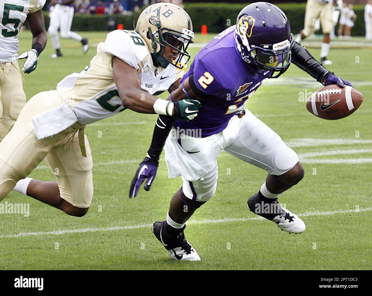 East Carolina's Justin Hardy (2) looks to put the ball across the goal ...