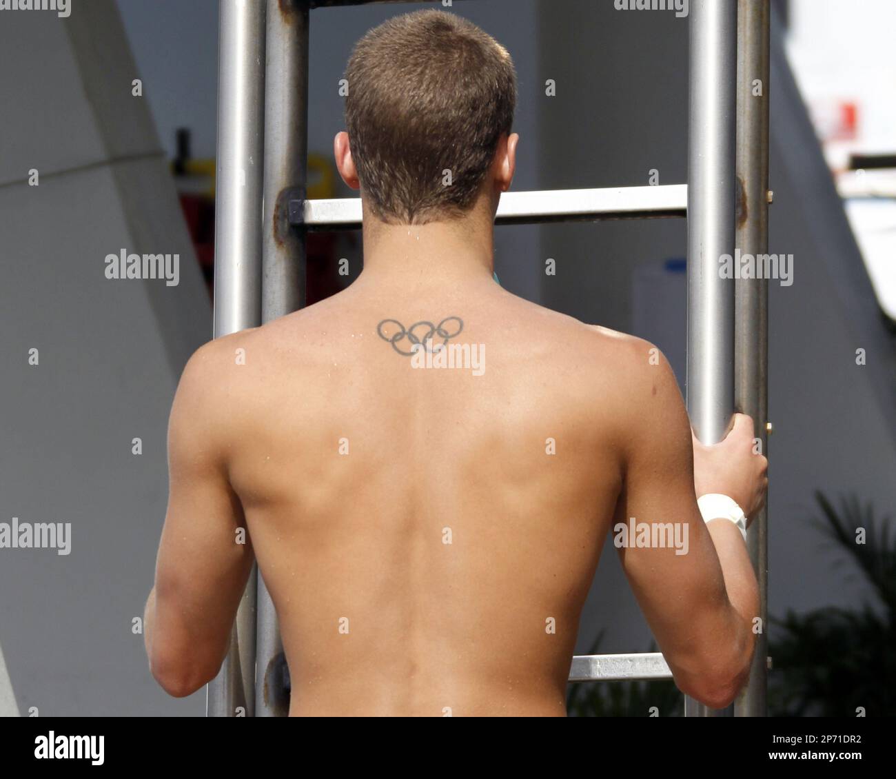 Thomas Finchum, of the USA, climbs the ladder to the 10 meter platform ...