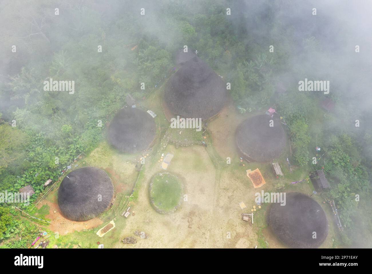 Bird's eye view of the conical thatched huts of the traditional village ...