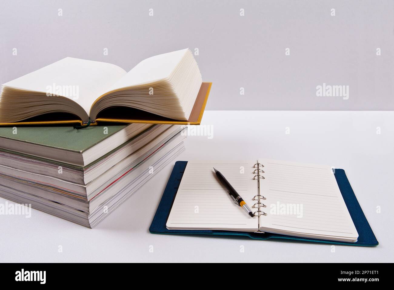 Books and laptops on a white background Stock Photo - Alamy
