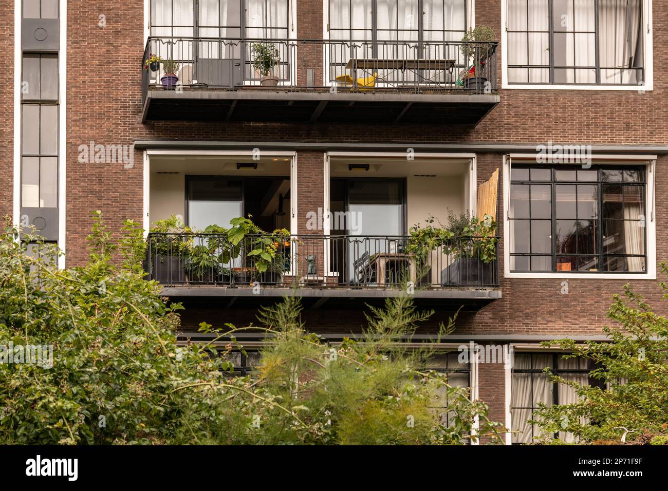 an apartment building with balconys and balks on the second floor, as ...