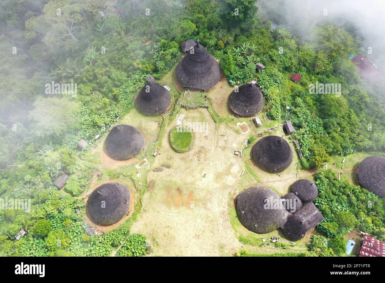 Bird's eye view of the conical thatched huts of the traditional village ...