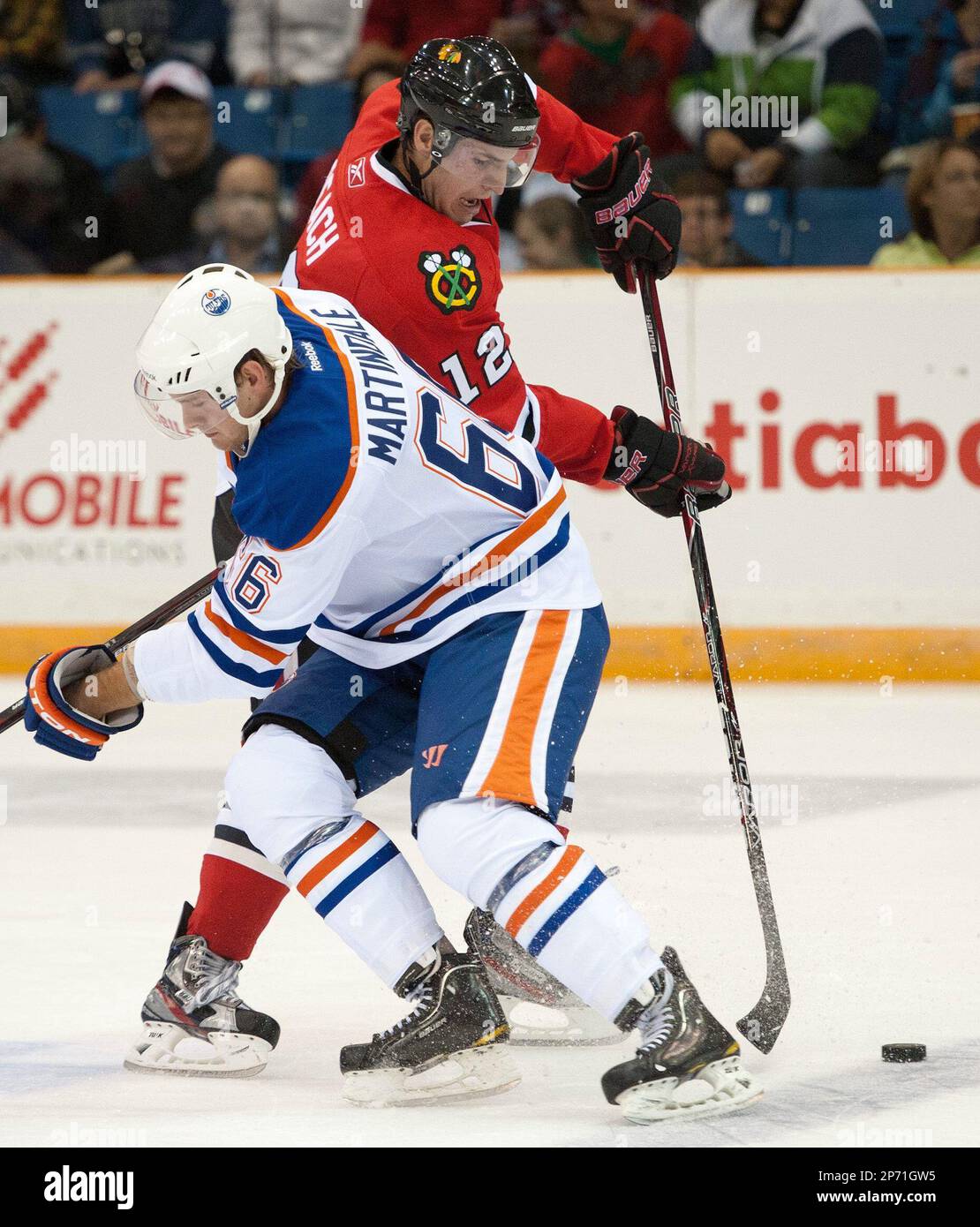 Chicago Blackhawks forward Kyle Beach, right, gets the puck past ...