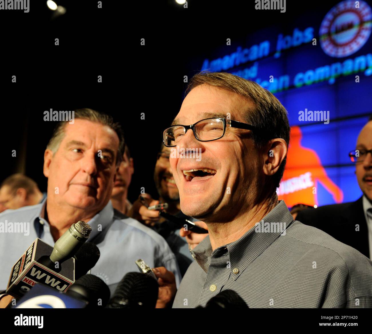 UAW president Bob King, right, is interviewed as vice president Joe ...