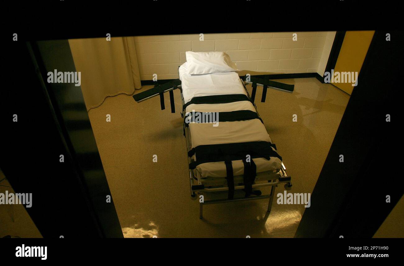 The gurney used for lethal injections sits behind glass windows in a ...