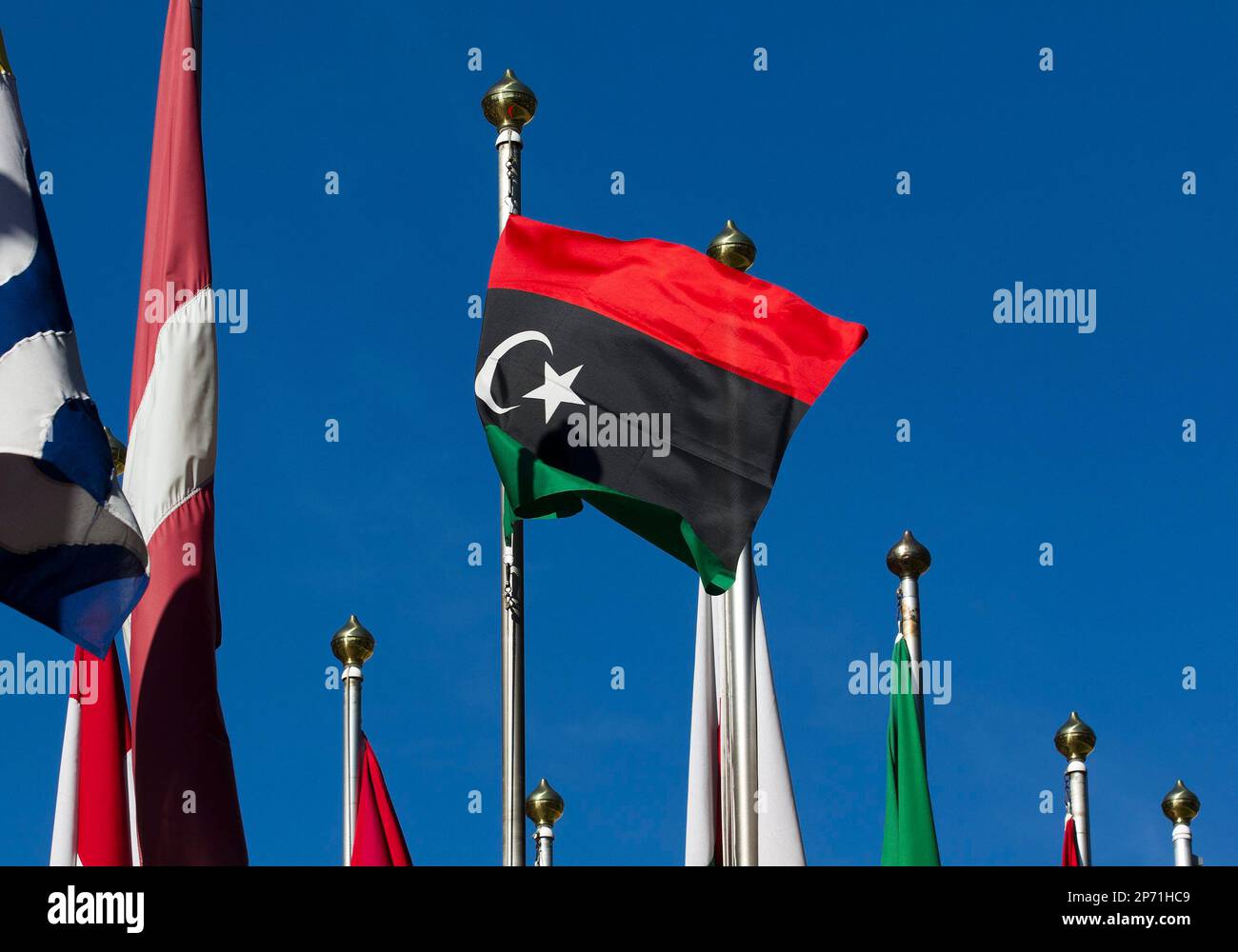 The flag of Libya's National Transitional Council flutters in the ...