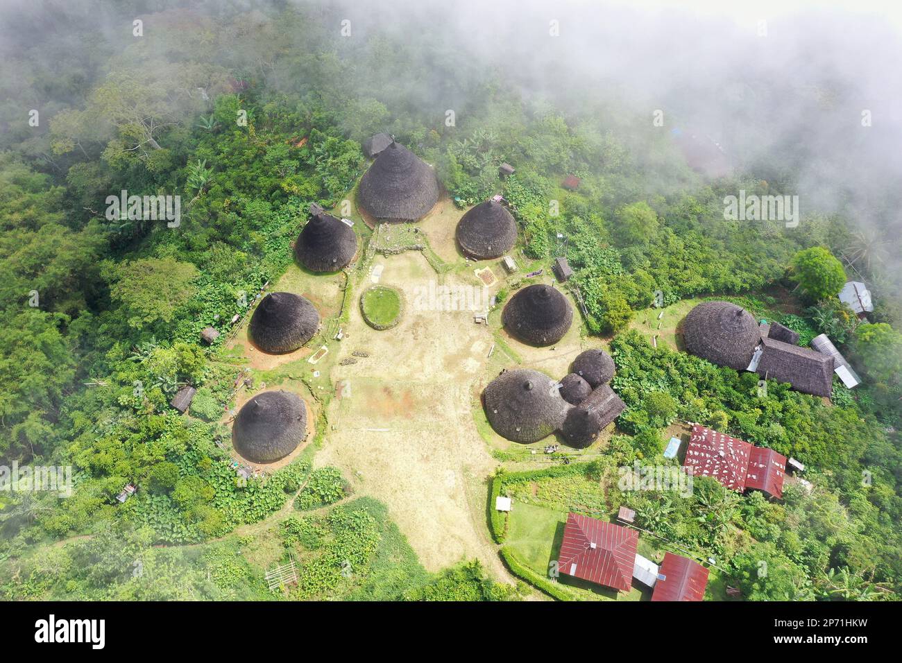 Bird's eye view of the conical thatched huts of the traditional village ...