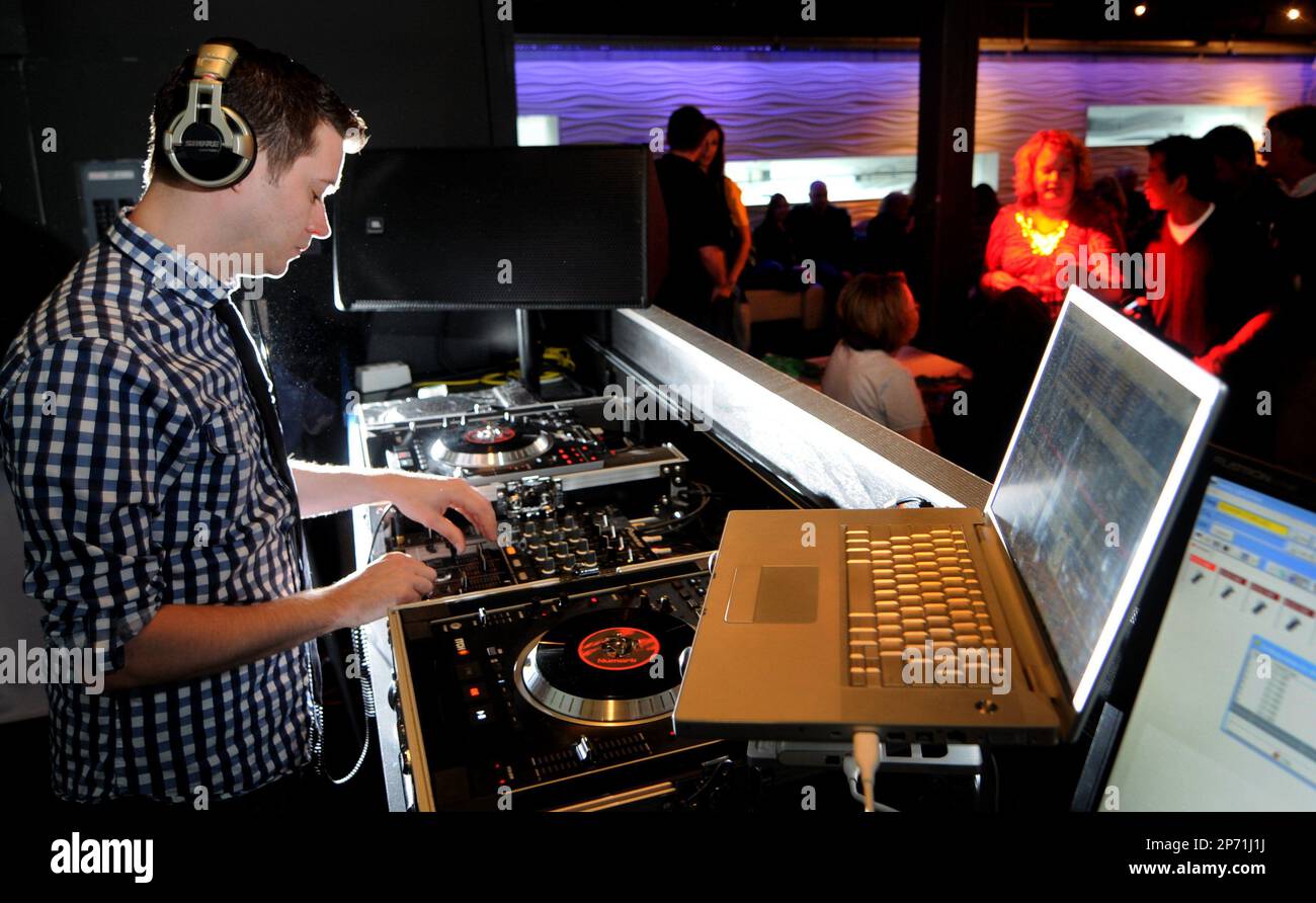 In this Sunday, Sept. 18, 2011 photo, disc jockey Mark Witz spins music ...