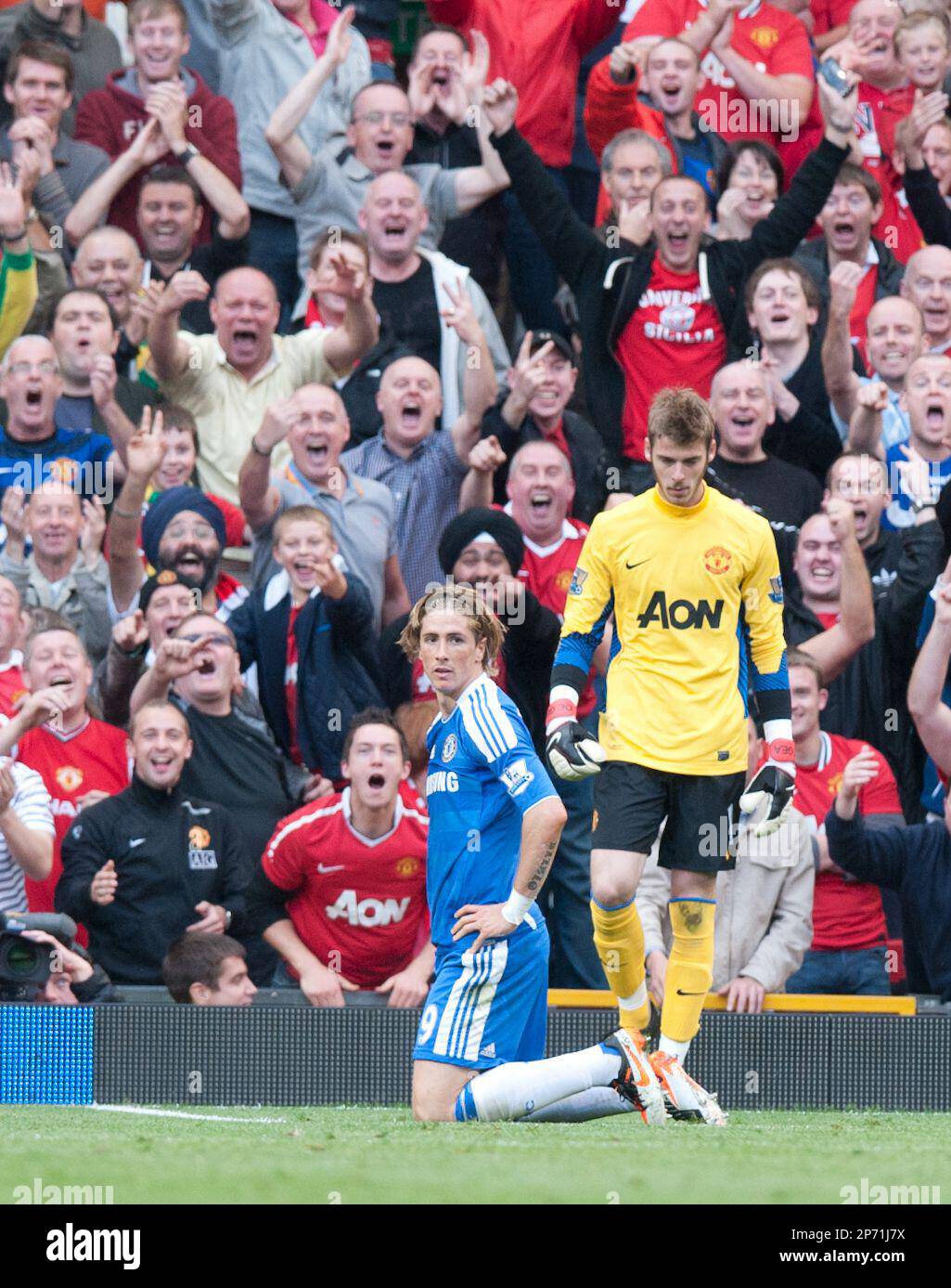 Fernando Torres of Chelsea is taunted by the Manchester United fans ...