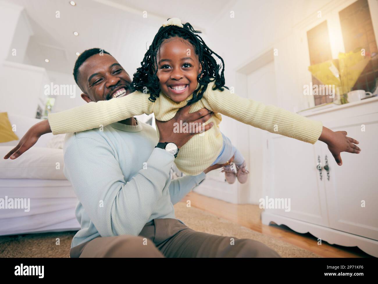 Black man, father and daughter with plane game, happiness and smile for ...