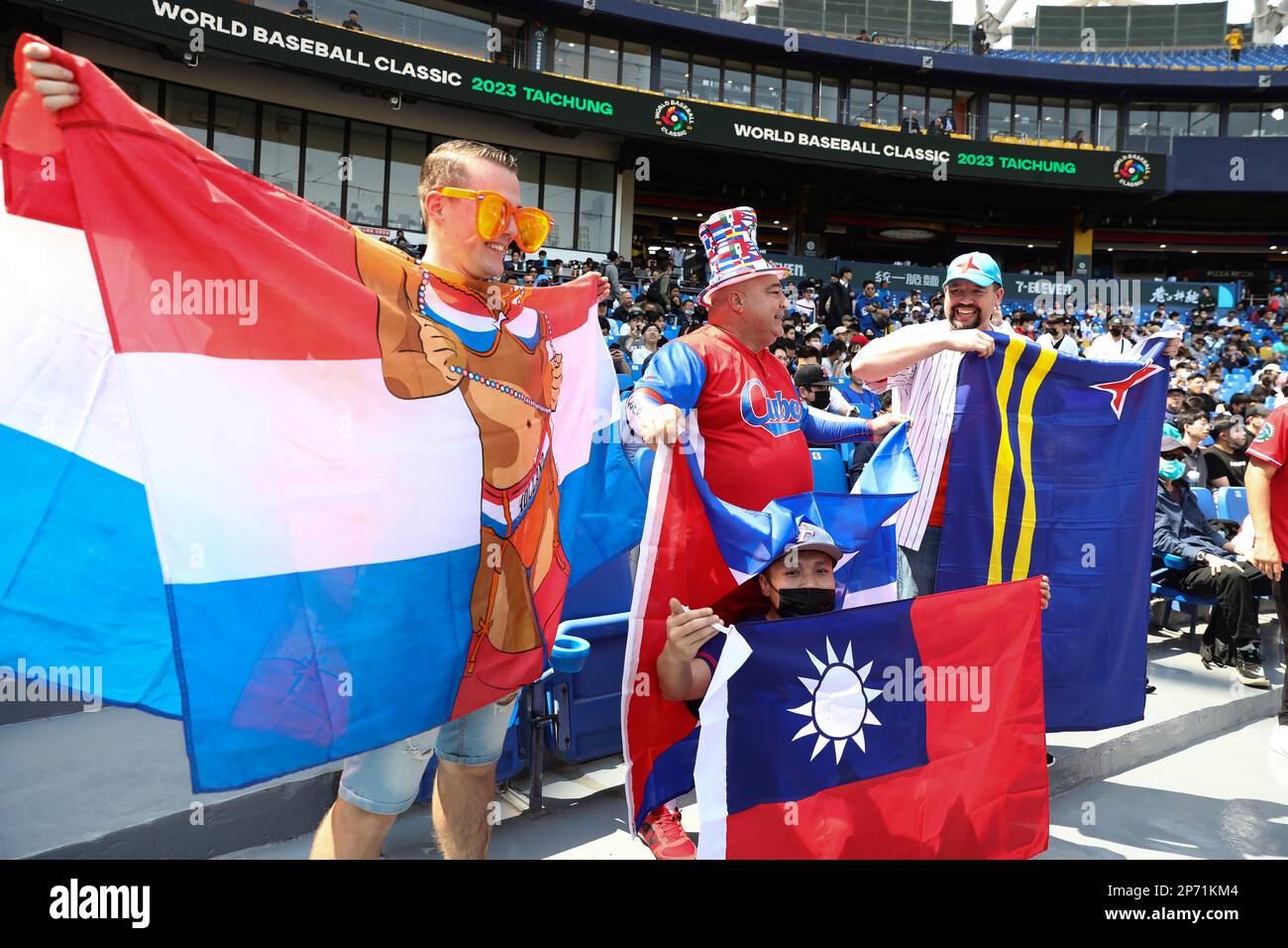 Baseball fans hold nationals flags of Cuba, Taiwan and Netherlands in ...