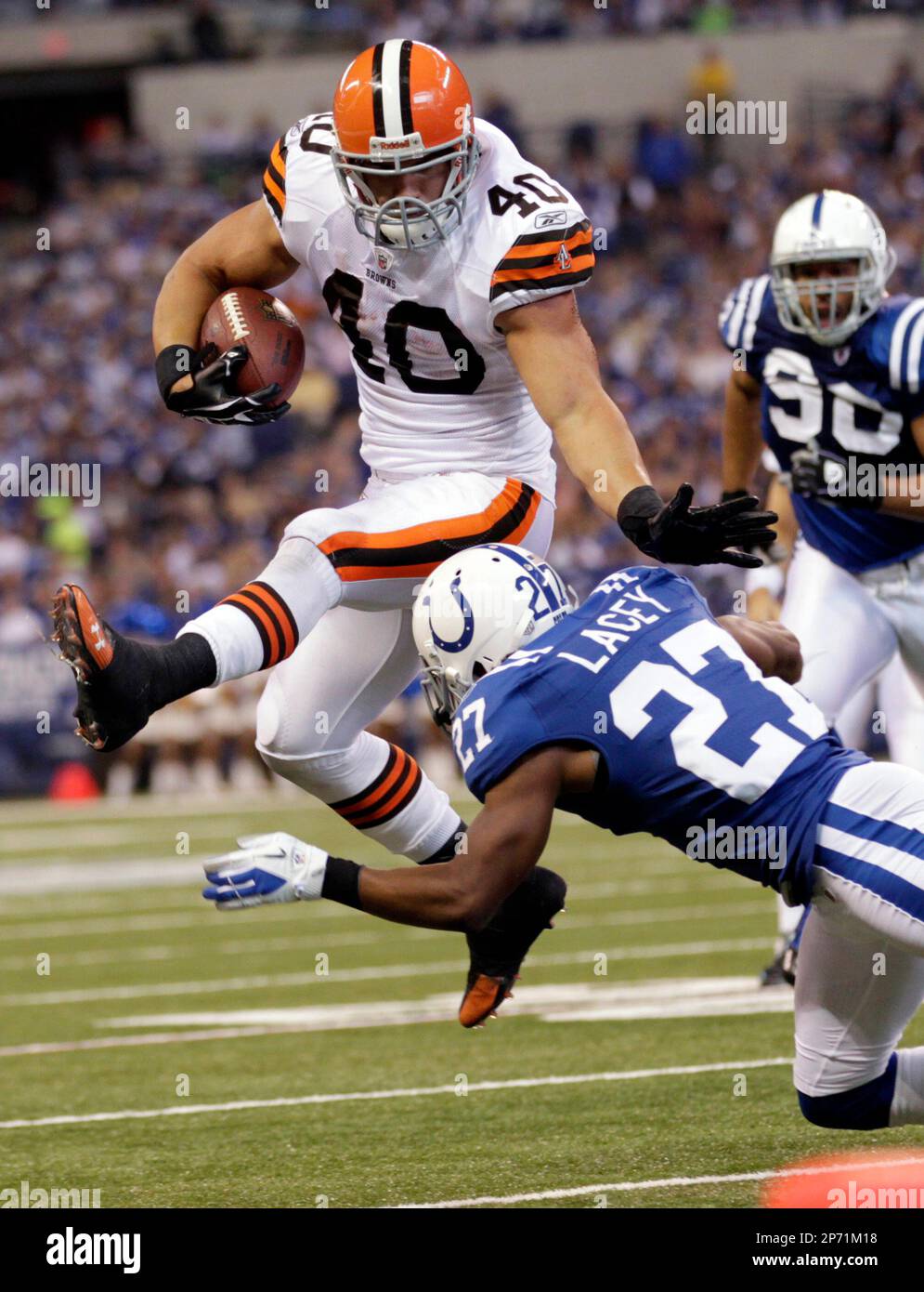 Cleveland Browns running back Peyton Hillis leaps over Indianapolis ...