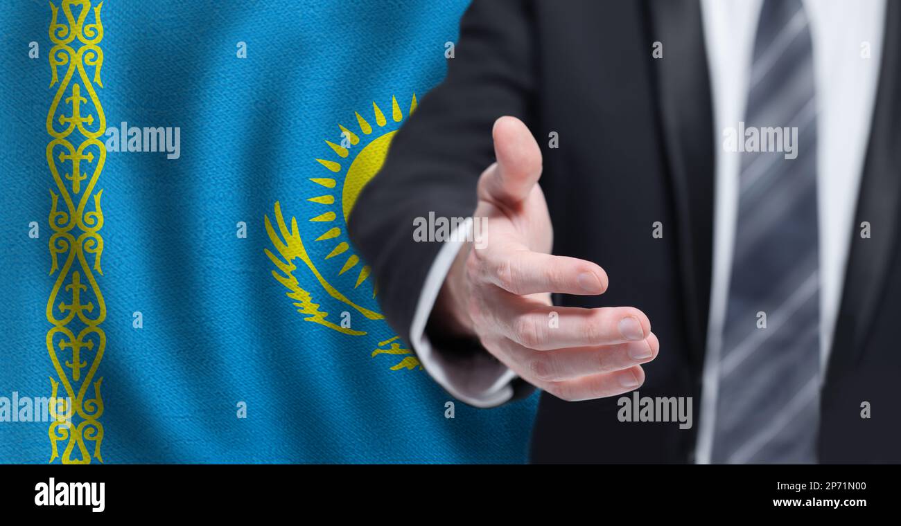 Kazakh business, politics, cooperation and travel concept. Hand on flag ...