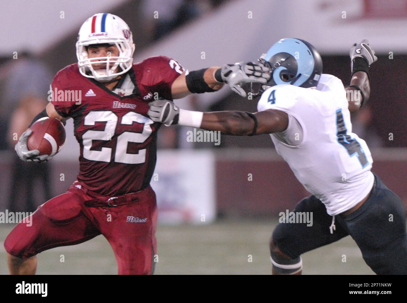 Massachusetts Jonathan Hernandez (22) runs past Rhode Island's Evan ...