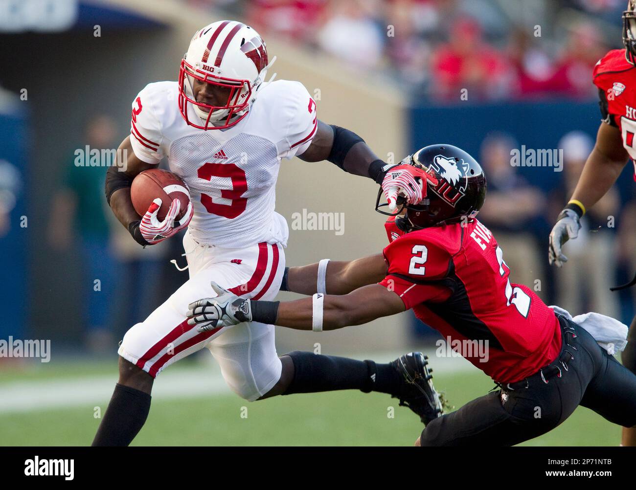 Wisconsin Badgers running back Melvin Gordon (3) stiff arms Northern ...