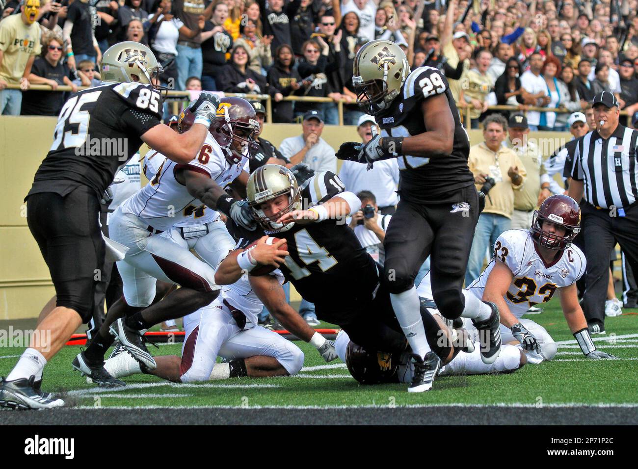 Western Michigan' quarterback Alex Carder, center, dives for the end ...