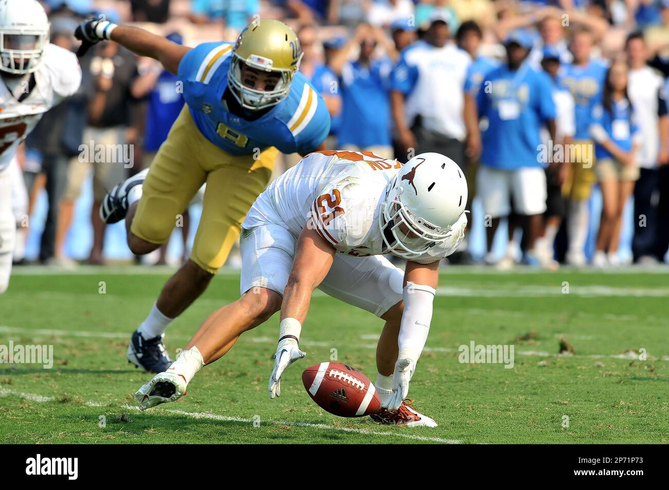 September 17, 2011 Los Angeles, CA..Blake Gideon #21 of Texas picks up ...