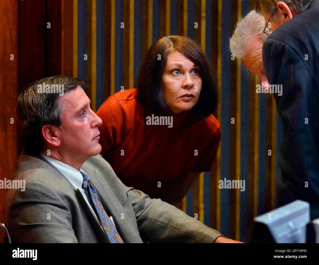 Defendant Michael George and his wife, Renee George, talk to defense ...