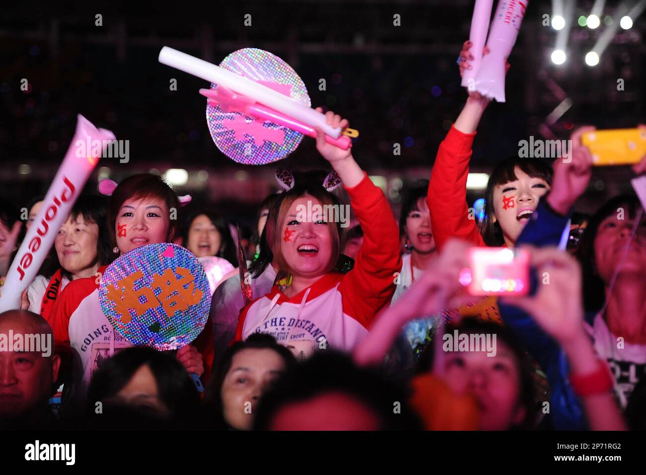 Fans of Japanese pop band SMAP watch performance during SMAP's concert ...