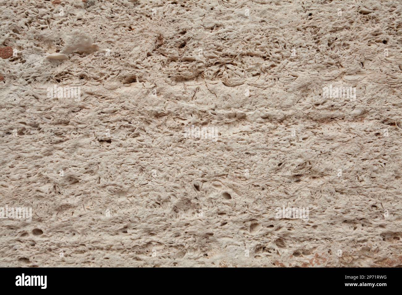 Yellow porous abstract stone background Stock Photo - Alamy
