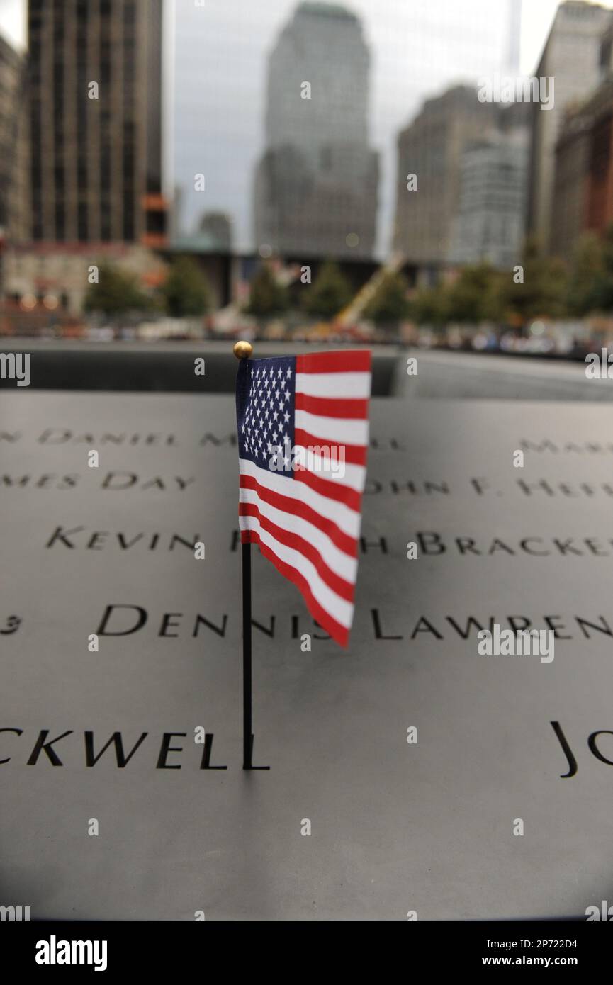 An American flag adorns the edge of the south pool of the Sept. 11 ...