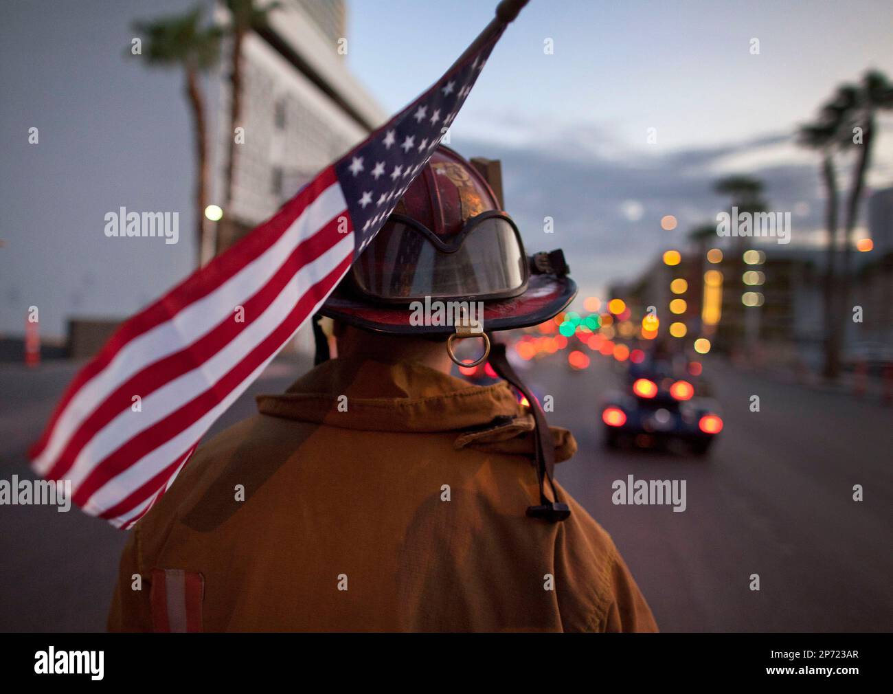 Las Vegas firefighter Capt. Eric Littmann walks in a parade ...