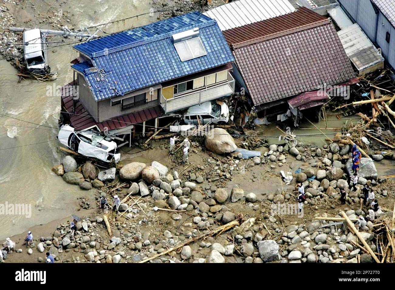 An aerial photo from Yomiuri's helicopter shows a house and cars ...