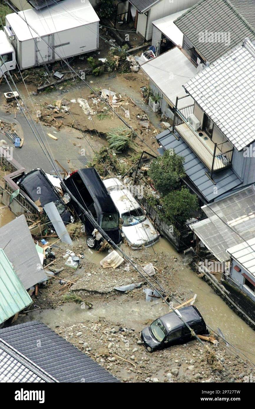 An aerial photo from Yomiuri's helicopter shows a house and cars ...